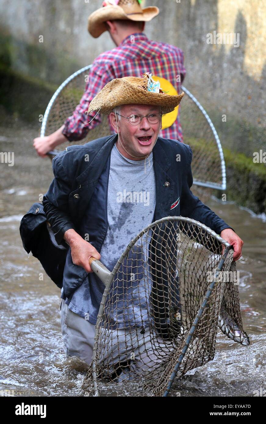 A participant of the Fischertag (lit. fishermen's day) cheers about his ...