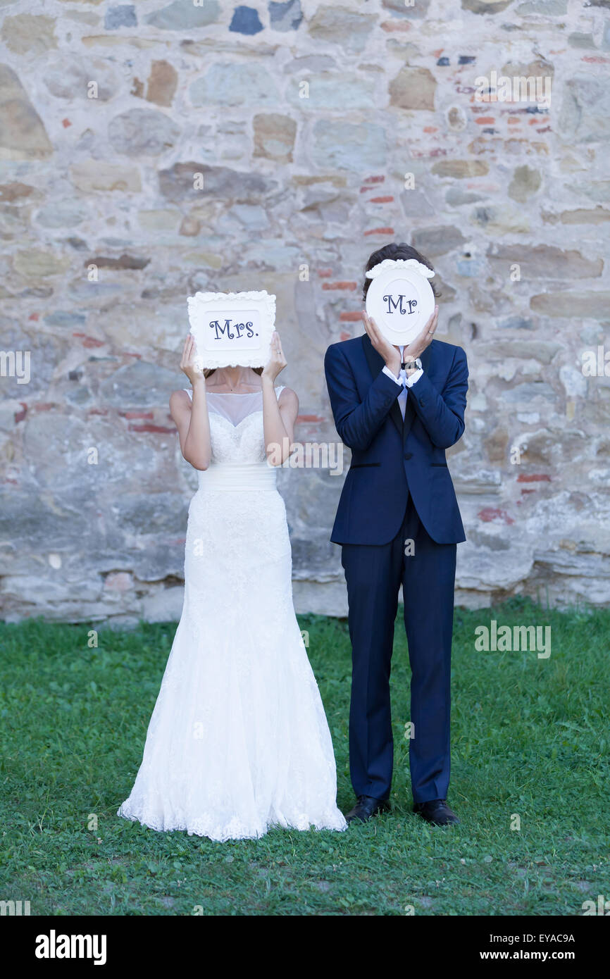 Love couple covering faces hi-res stock photography and images - Alamy