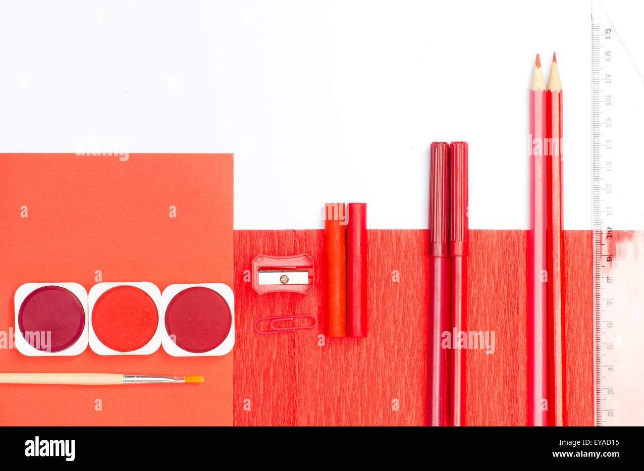 red color school supplies on white paper background Stock Photo - Alamy