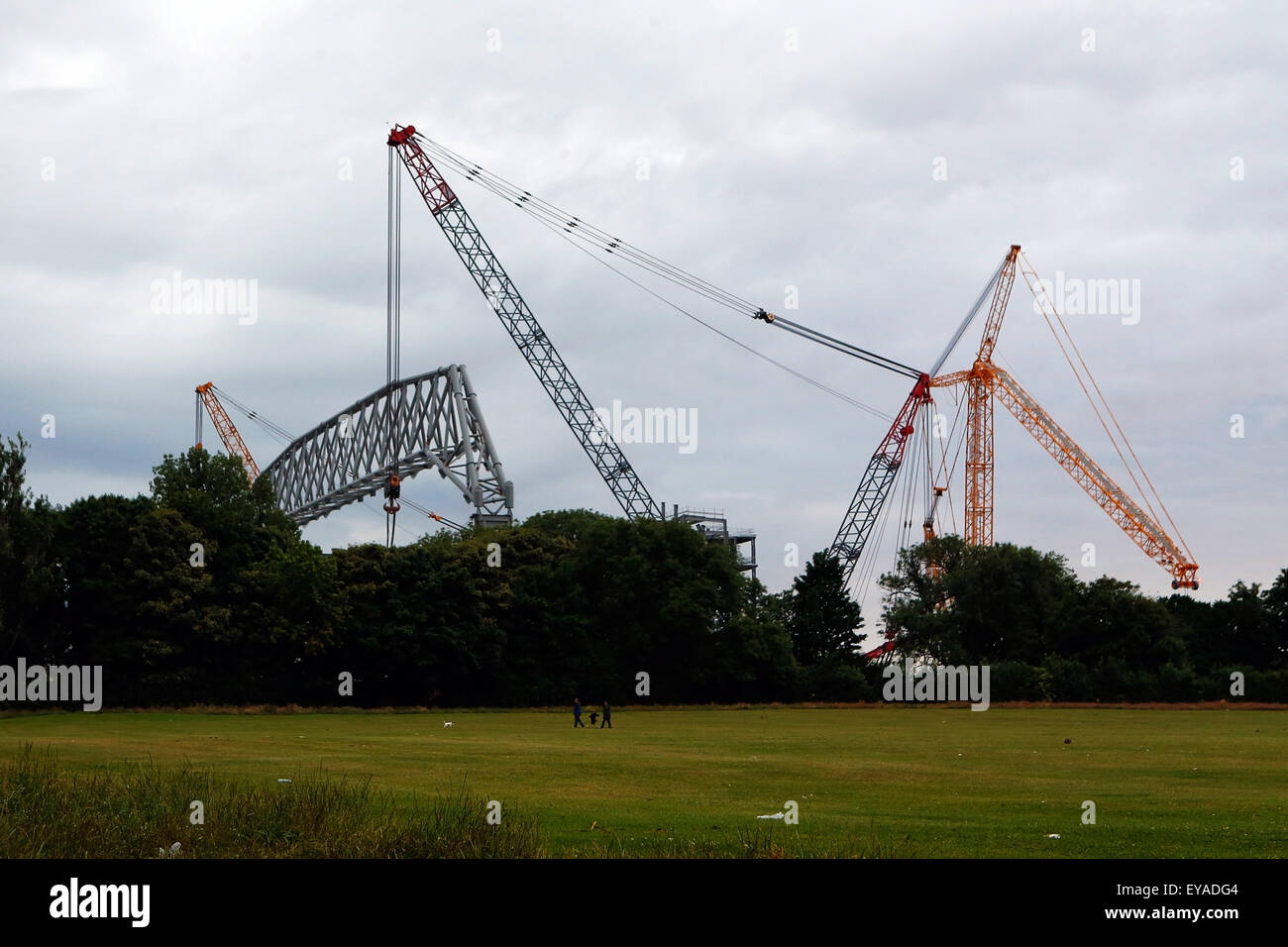 Liverpool, UK. 24th July, 2015. Anfield Redevelopment. Giant cranes ...