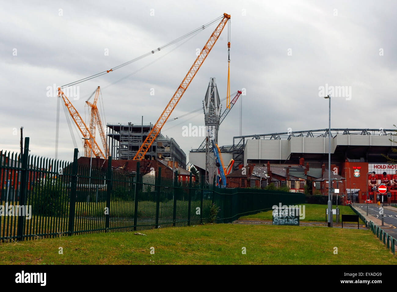 Liverpool, UK. 24th July, 2015. Anfield Redevelopment. Giant cranes ...