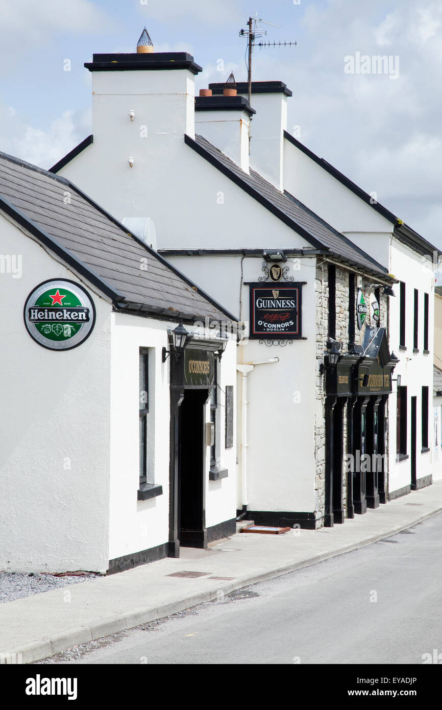O'Connors Pub In A White Buildings With Signs Advertising Beer; Doolin ...