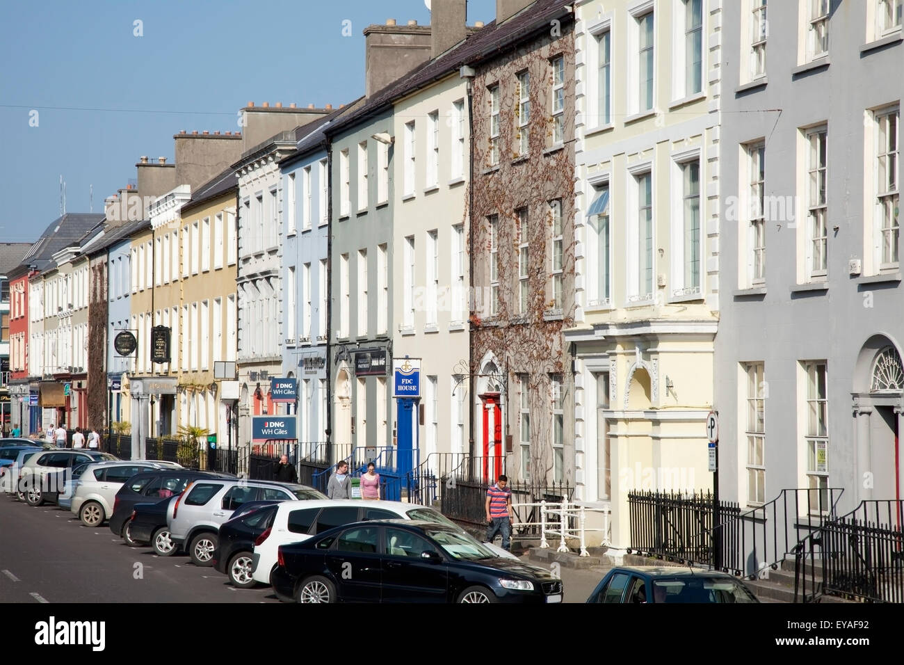 Row houses and parked cars along the street;Tralee county kerry ireland ...