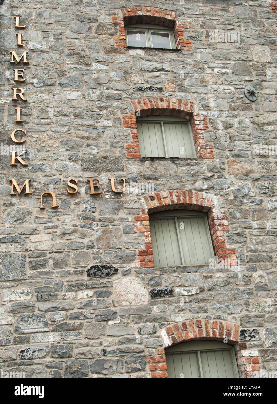 Broken Sign For Limerick Museum On The Side Of A Stone Building ...