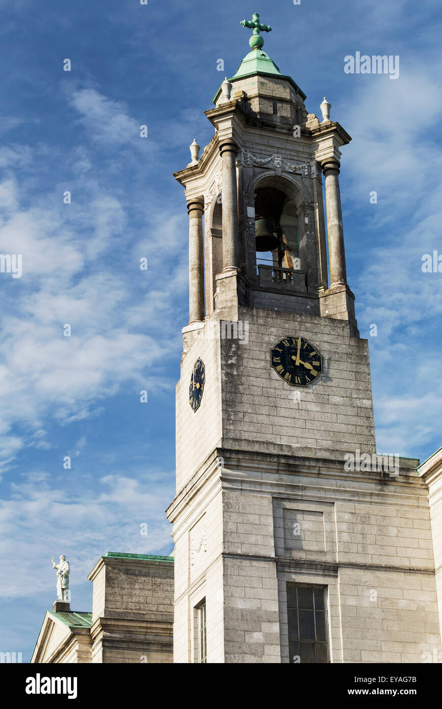 Stone church steeple and bell tower with clouds and blue sky; Athlone ...