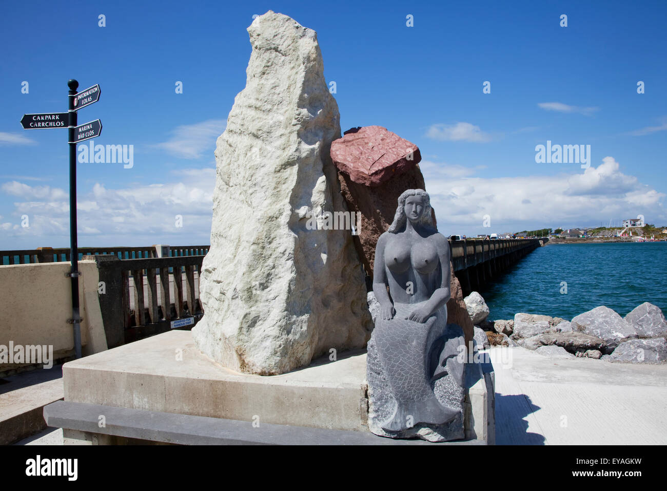 Statue of a mermaid sitting at the water's edge; Fenit, County Kerry ...