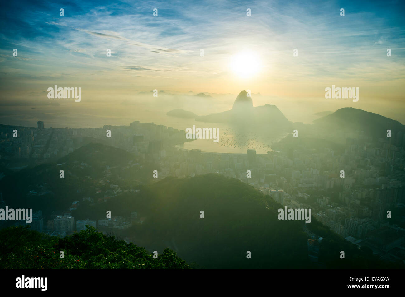 Scenic sunrise in Rio de Janeiro Brazil glows golden over Guanabara Bay ...