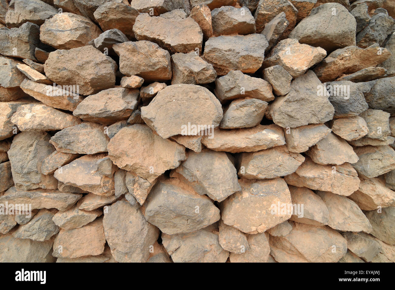 Brick wall made of rocks Stock Photo - Alamy