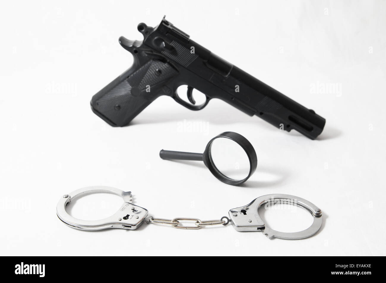 Weapon Crime Concept Gun and Handcuffs Stock Photo - Alamy