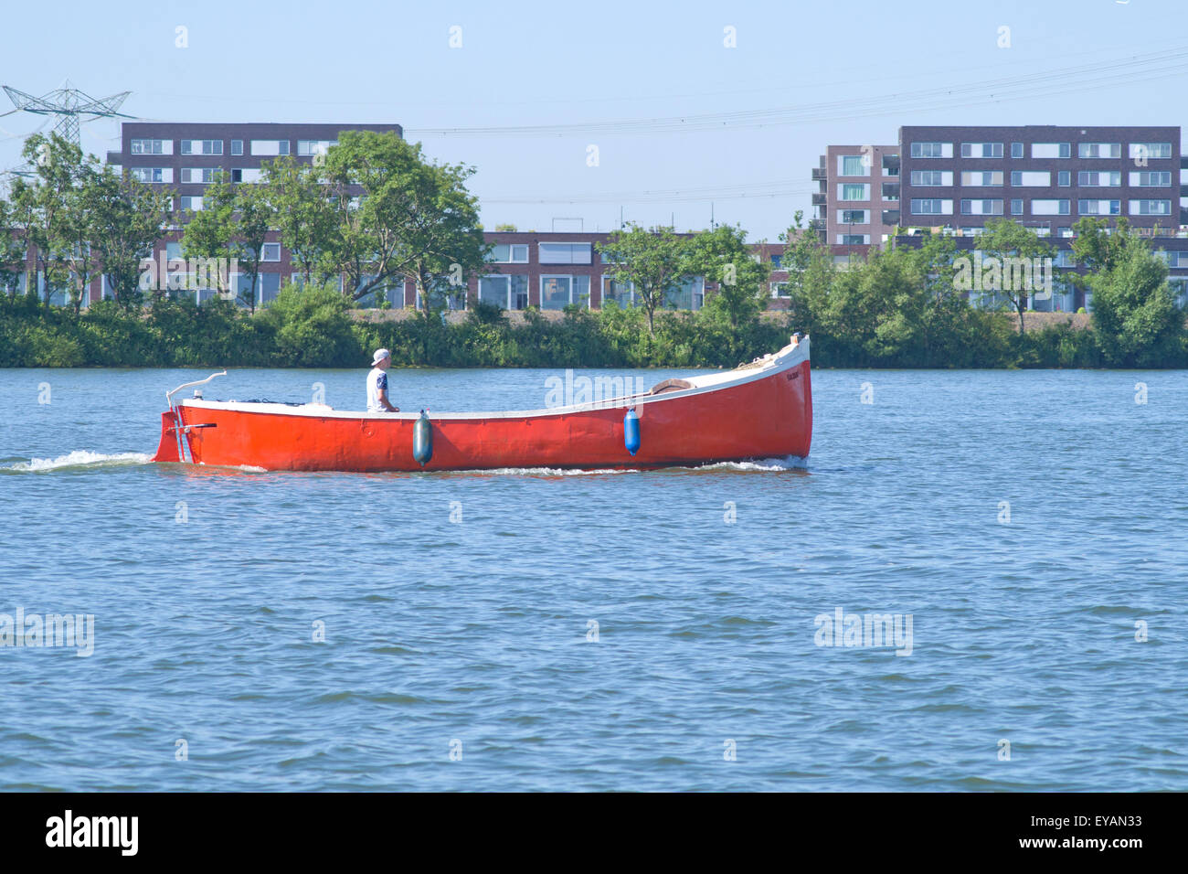 Small Red motor boat on the North Sea Canal Holland Stock Photo - Alamy