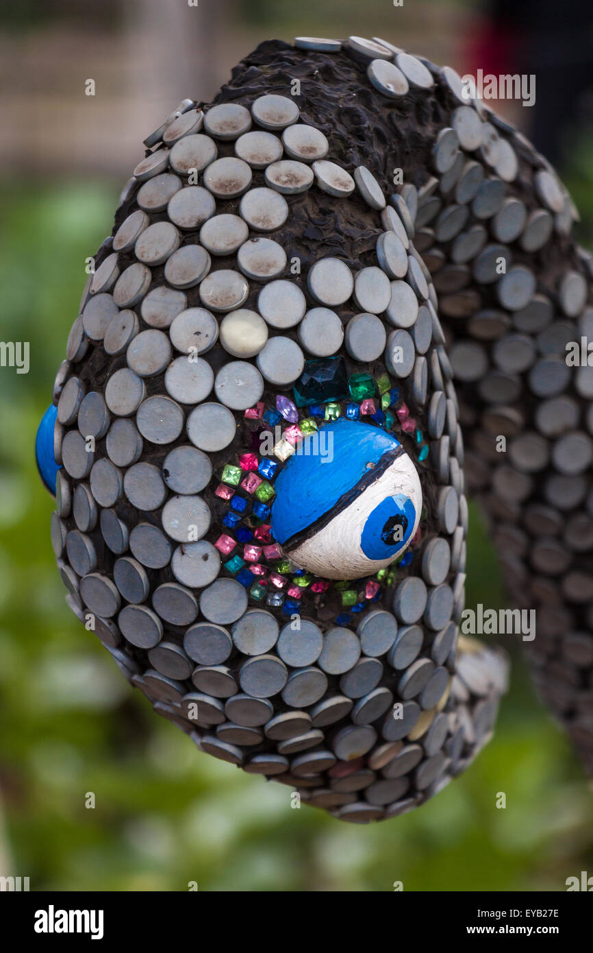 An abstract sculpture of a birds head covered in colorful sequins Stock ...