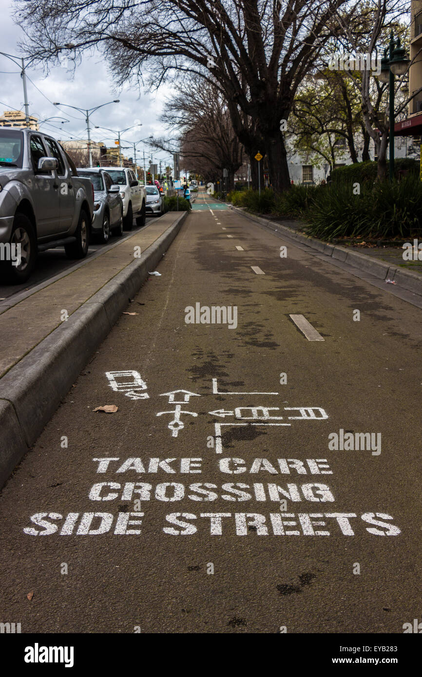 Painted road sign on asphalt Stock Photo - Alamy