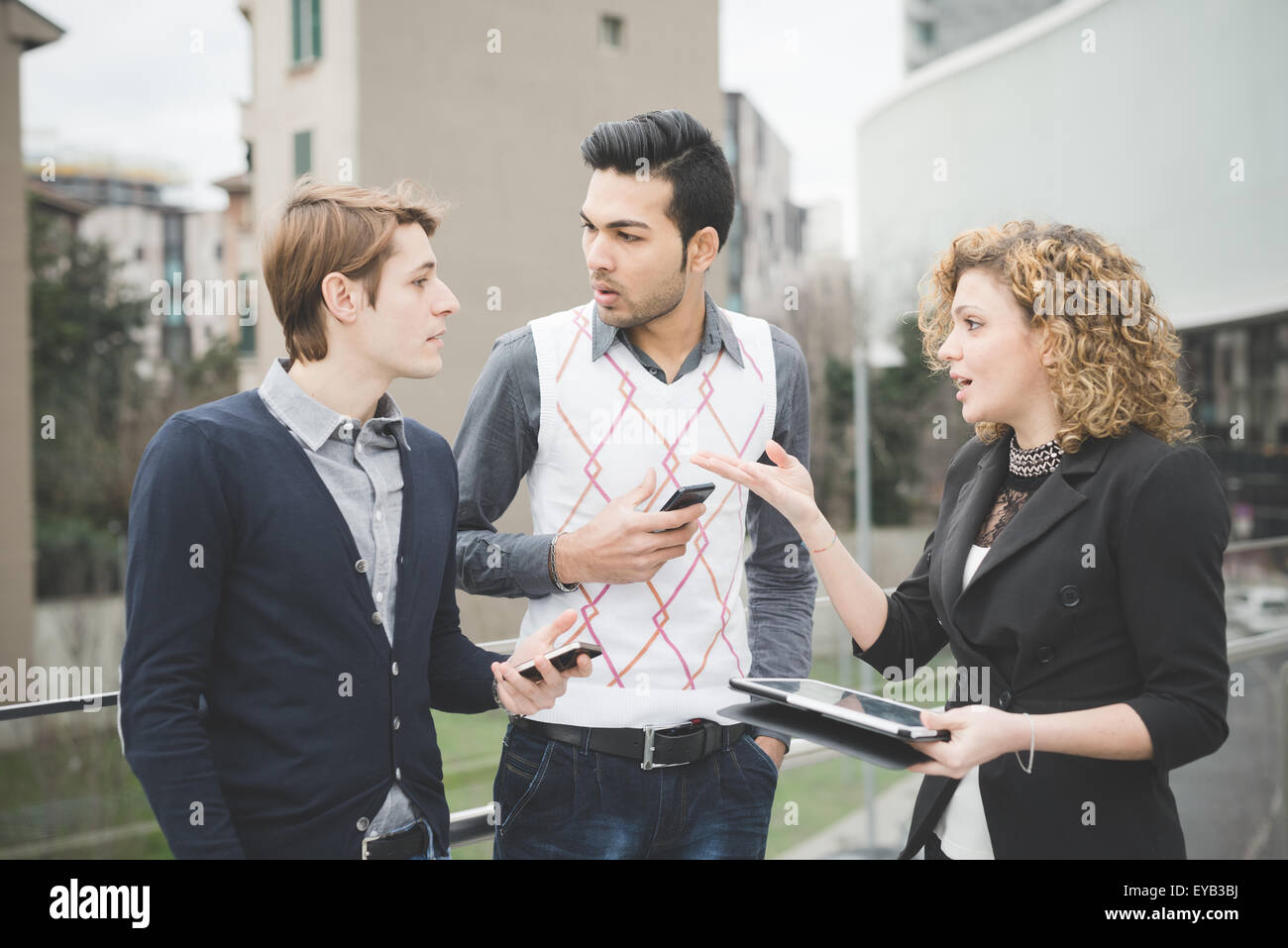 Multiracial contemporary business people working outdoor in town ...