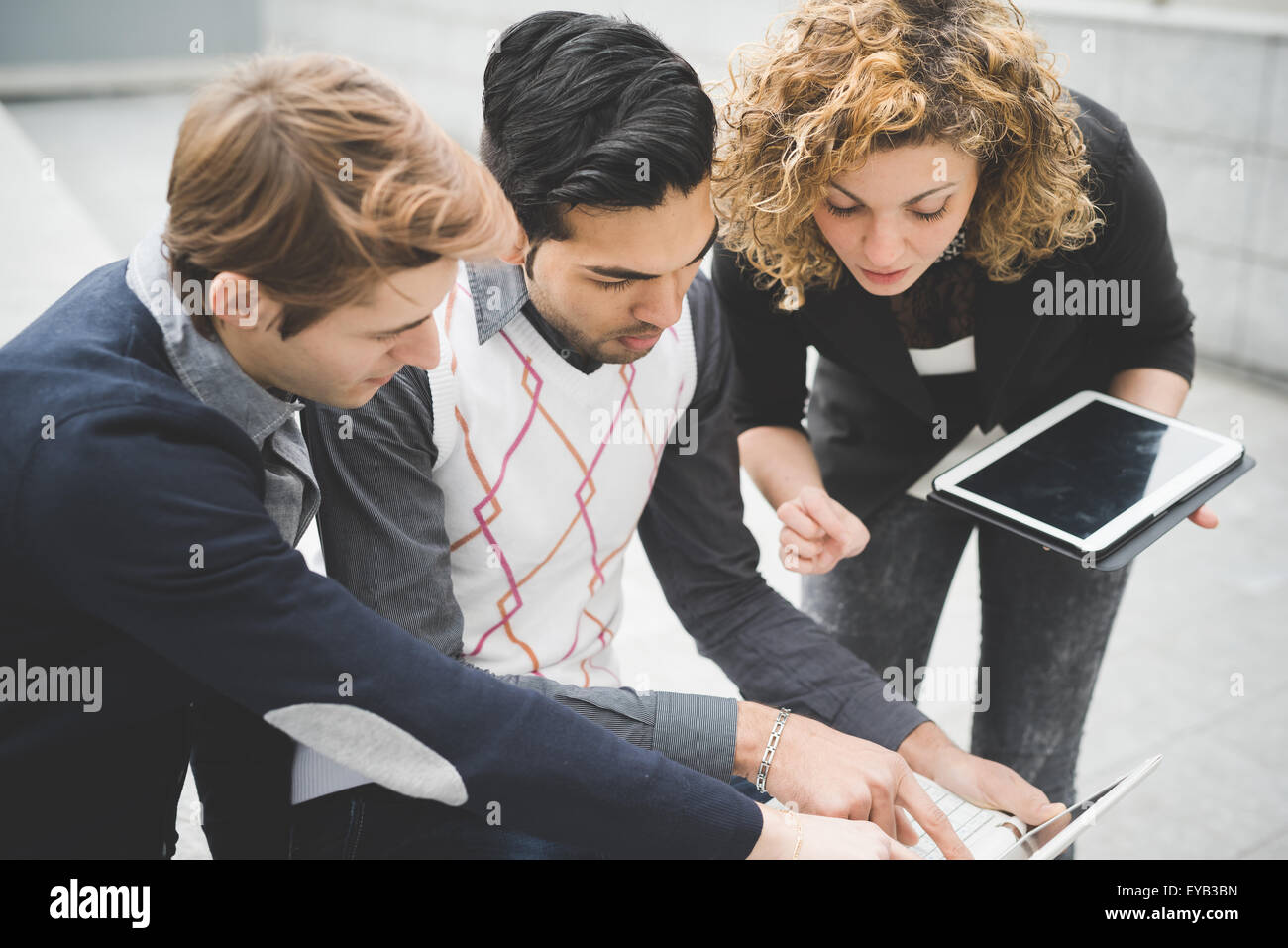 Multiracial contemporary business people working outdoor in town ...