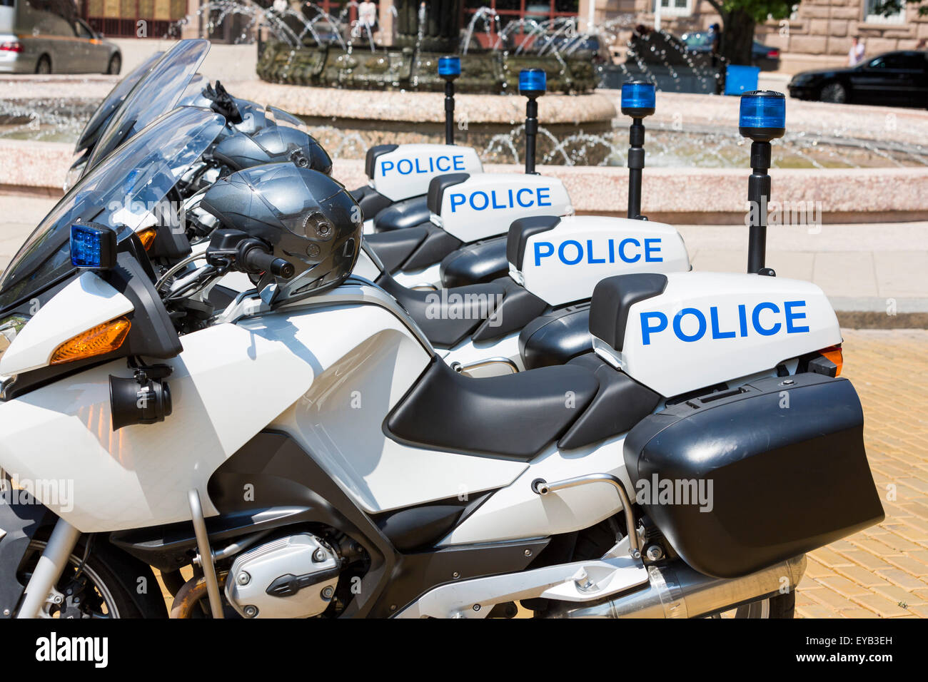 New police motorcycles in line with helmets on them Stock Photo - Alamy