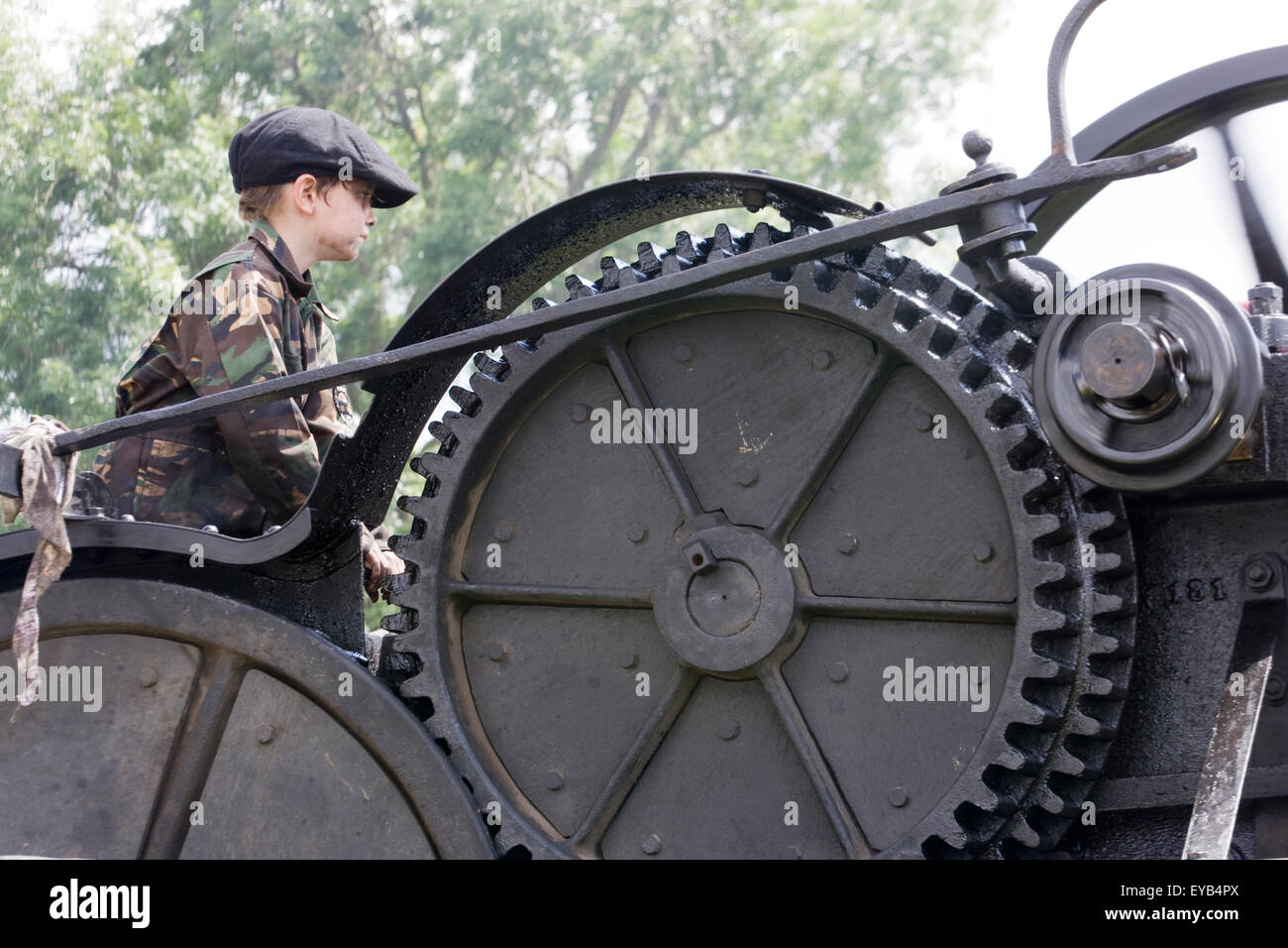 Coal boy working a steam engine Stock Photo - Alamy
