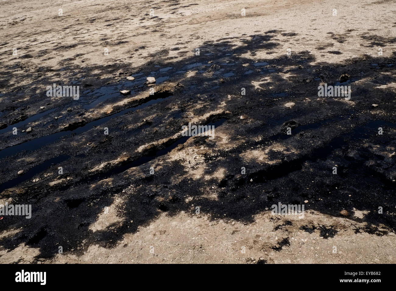 Crude oil puddle in an oil field in Azerbaijan Stock Photo - Alamy