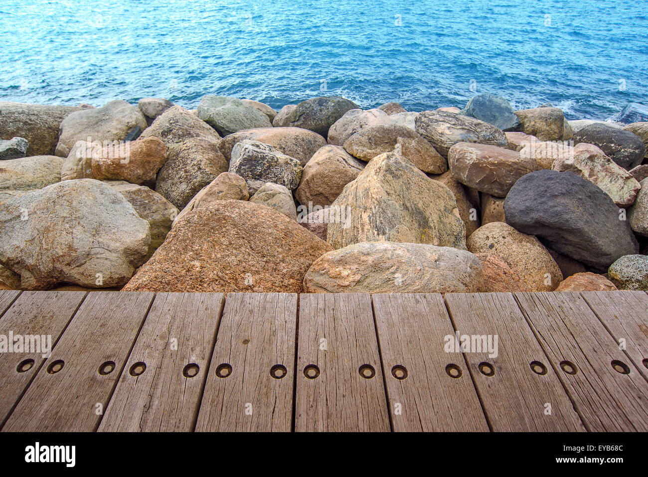 Boardwalk and Rocks At Seashore, Natural Background Stock Photo - Alamy