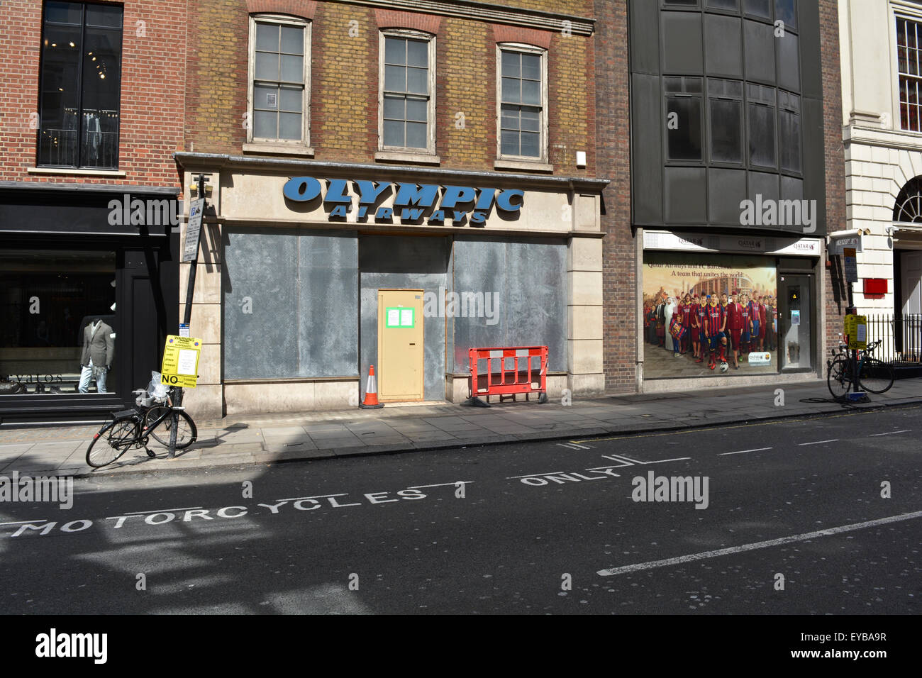 Boarded up storefront of Olympic Airways office in Mayfair, London, UK ...