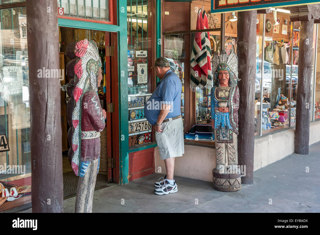 Obese man window shopping at Taos Plaza. New Mexico. USA Stock Photo ...