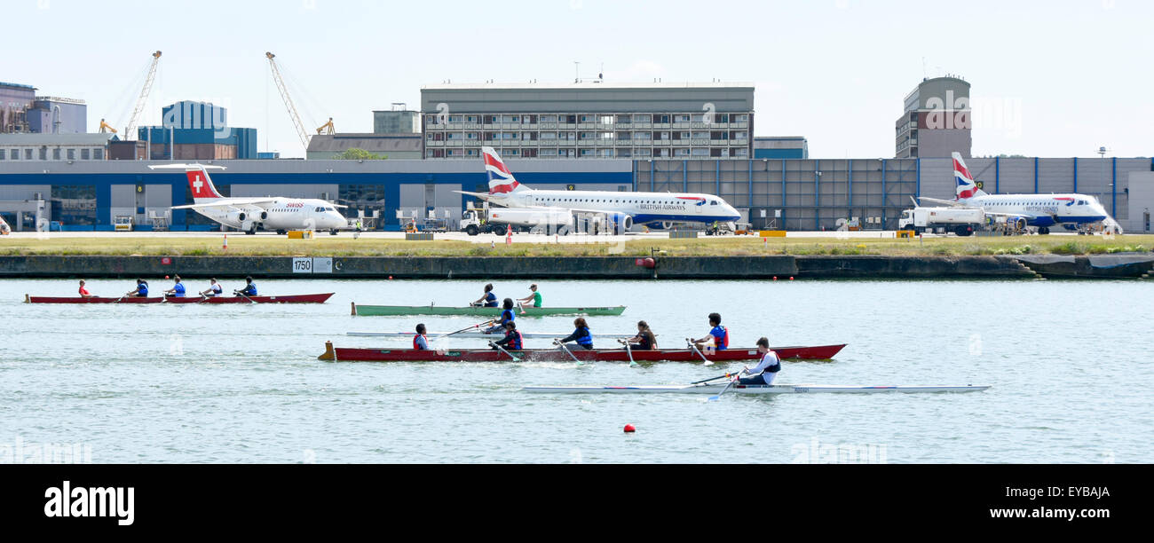 Aircraft at London City Airport with rowers training in the old Royal ...