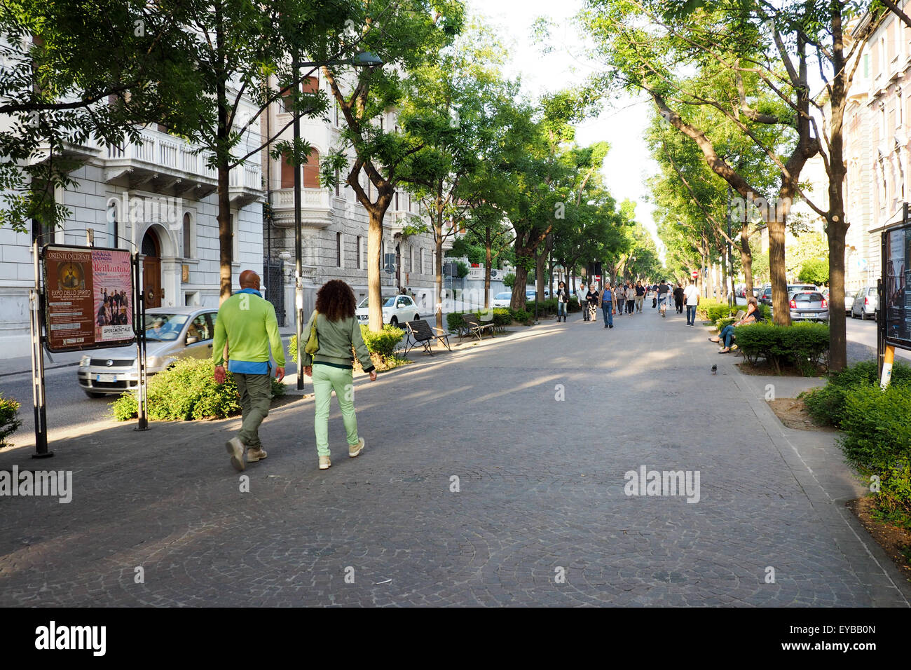 Pedestrians walking along a wide pathway Stock Photo - Alamy