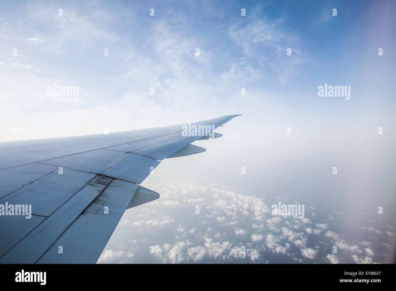 Views looking out a plane window at the dramatic sky during a flight ...