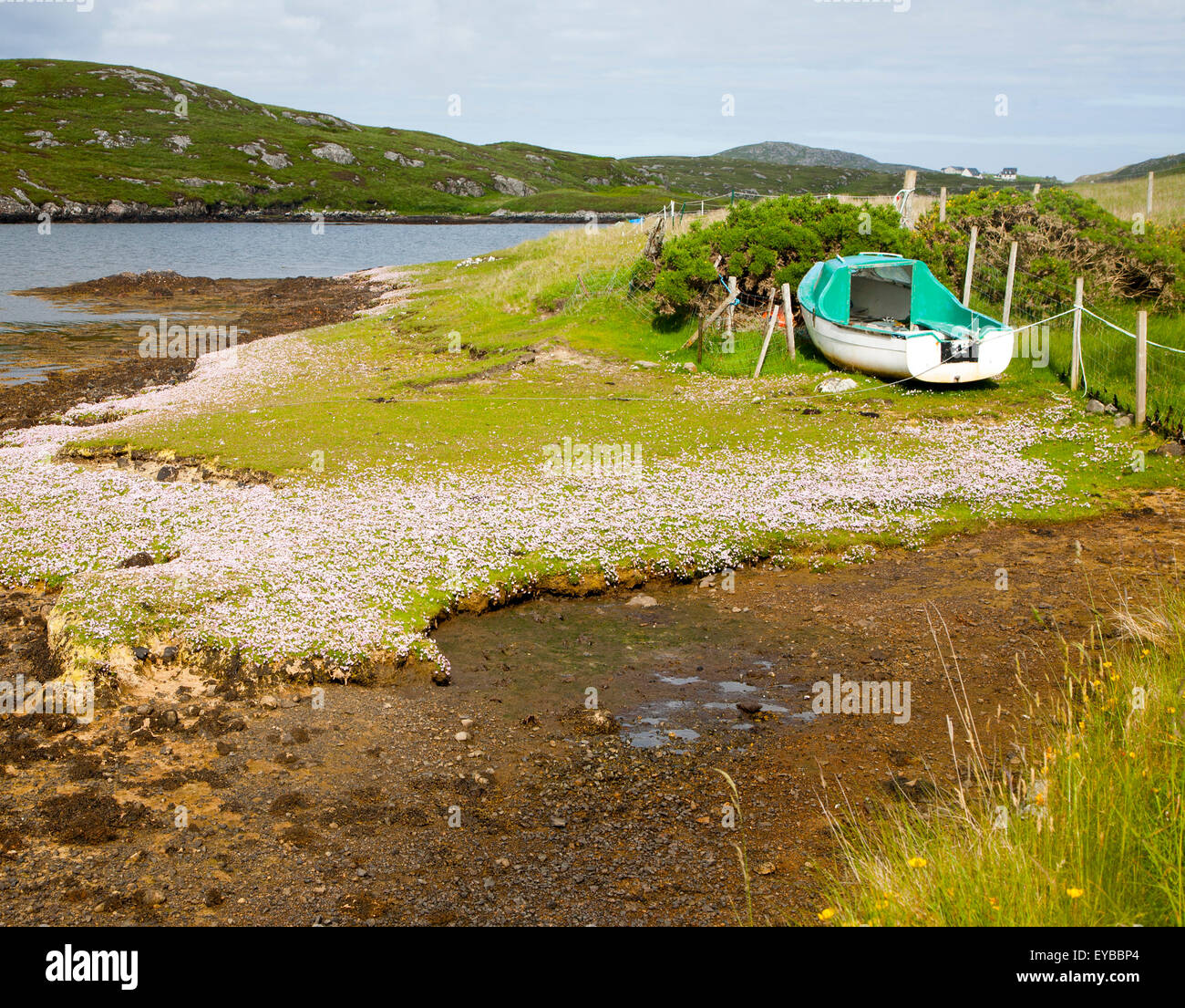 Small fishing boat on the east coast of barra hi-res stock photography ...