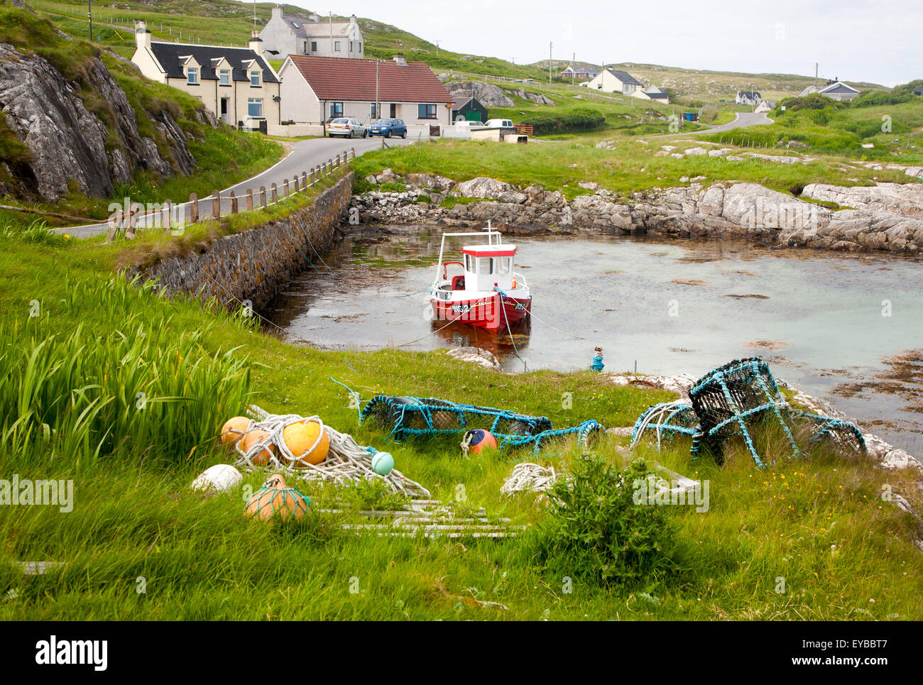 Small fishing boat on the east coast of barra hi-res stock photography ...