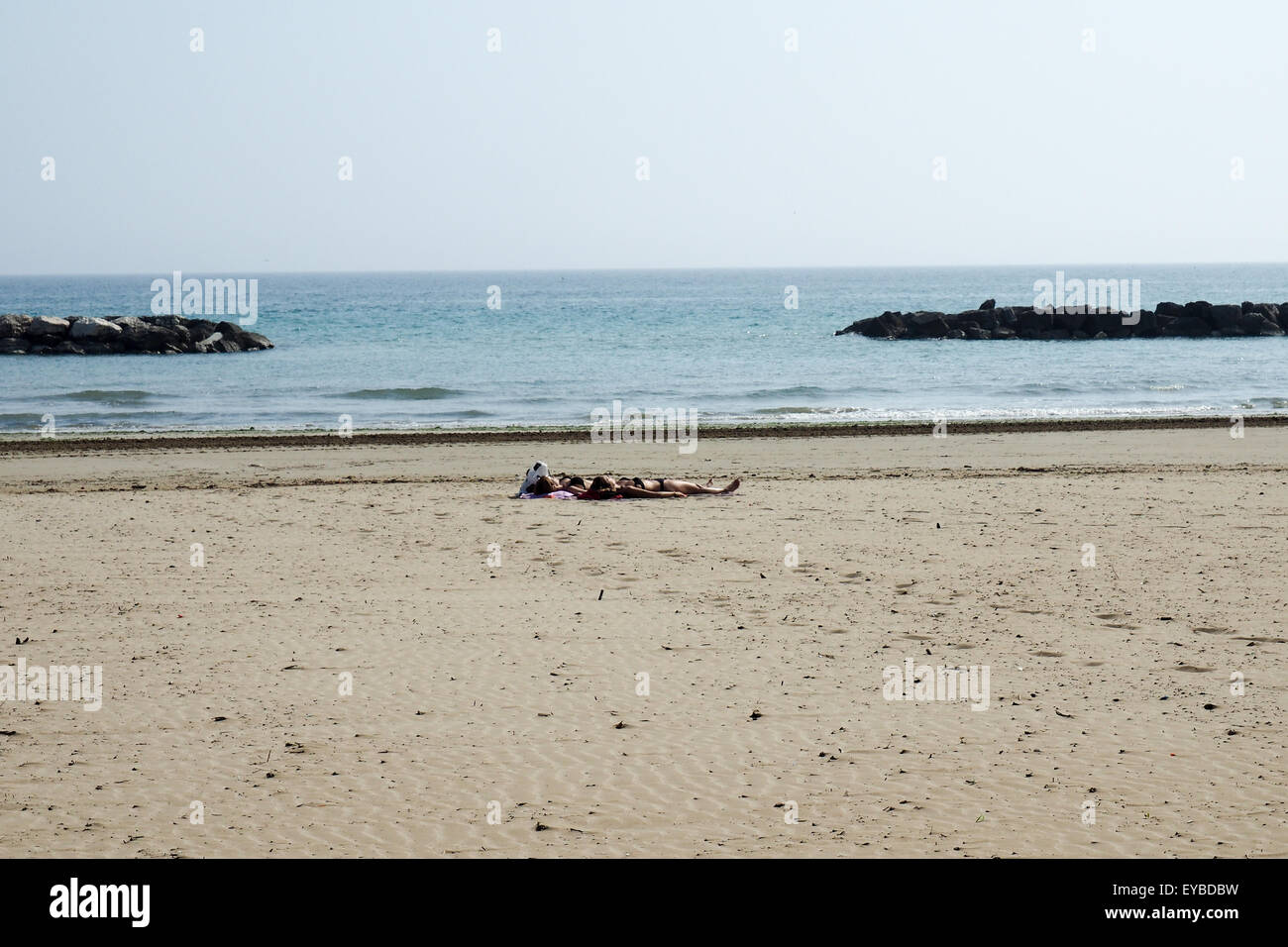 Italian woman sunbathing on beach hi-res stock photography and images ...