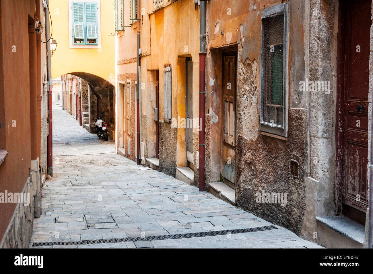 Old houses along narrow cobblestone street in medieval town ...