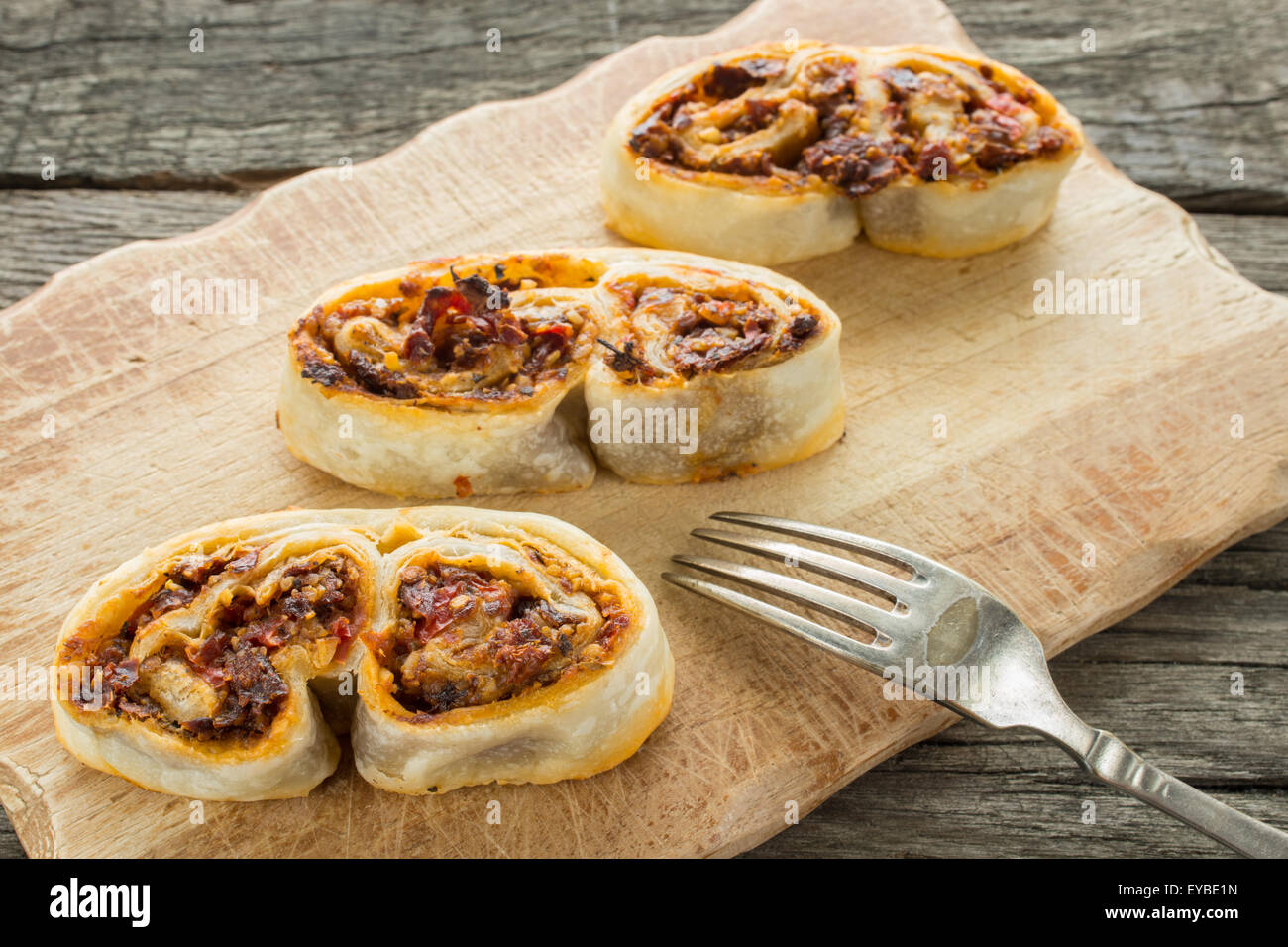 Palmiers with flaky pastry and tomato and pine nuts filling Stock Photo ...