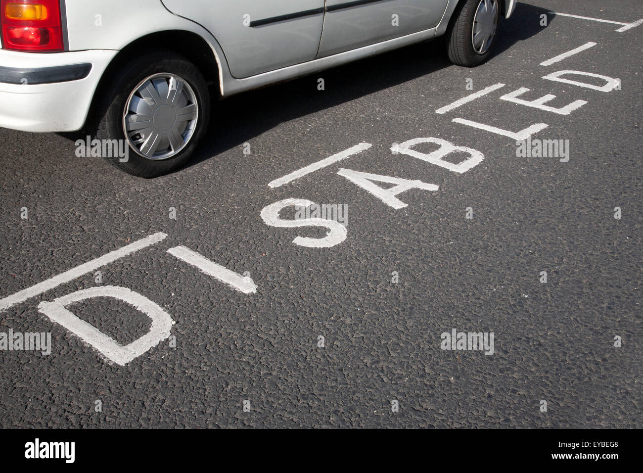 Disabled Parking Space in Urban Street Stock Photo - Alamy