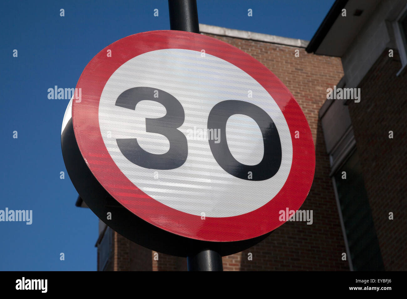 Thirty Speed Sign against Blue Sky Background Stock Photo - Alamy