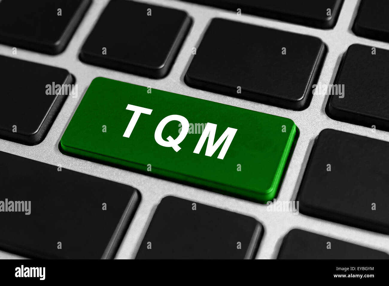 TQM or Total quality management button on keyboard, business concept ...