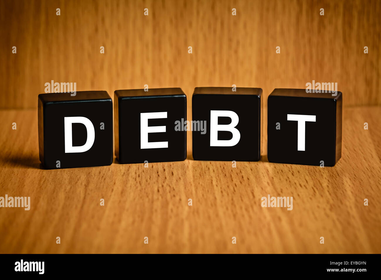 financial interest bearing debt text on black block Stock Photo - Alamy