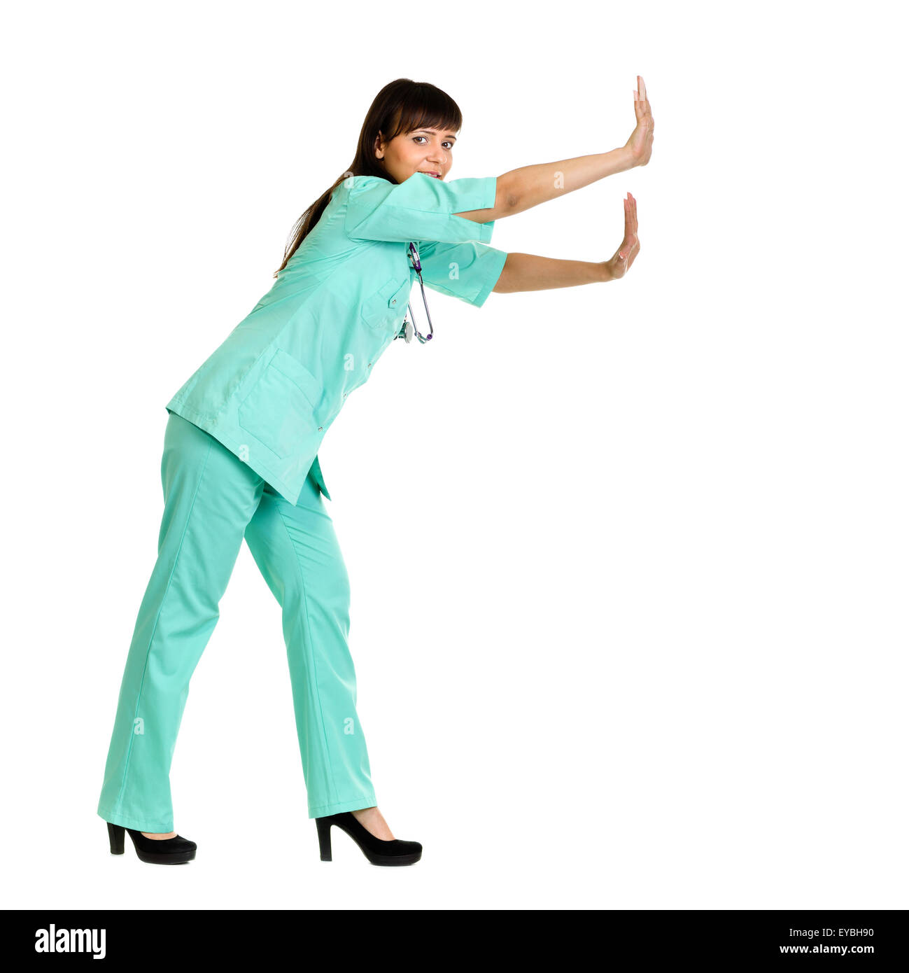 Female doctor pushing or leaning on wall Stock Photo - Alamy