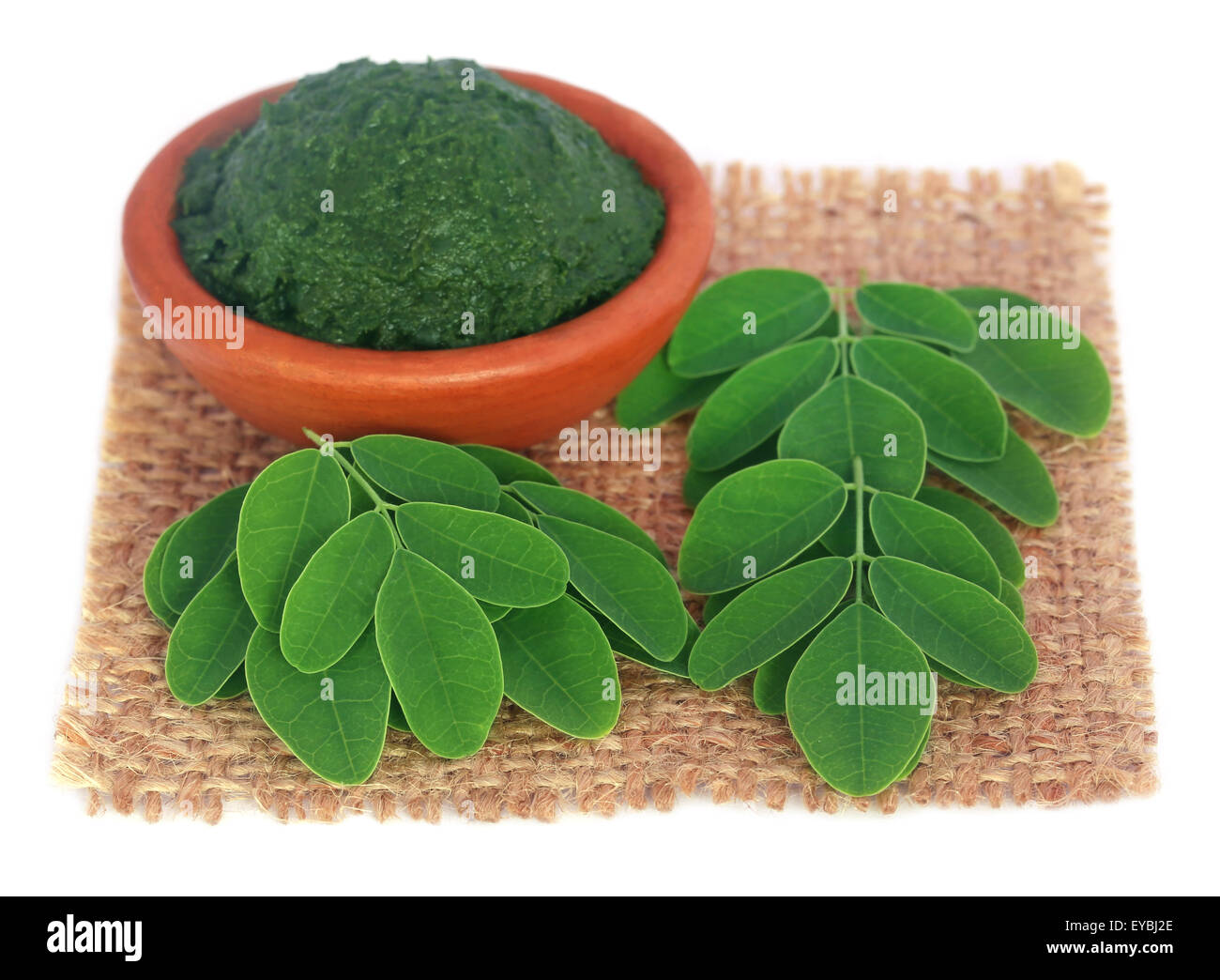 Edible moringa leaves with ground paste on sack surface Stock Photo - Alamy