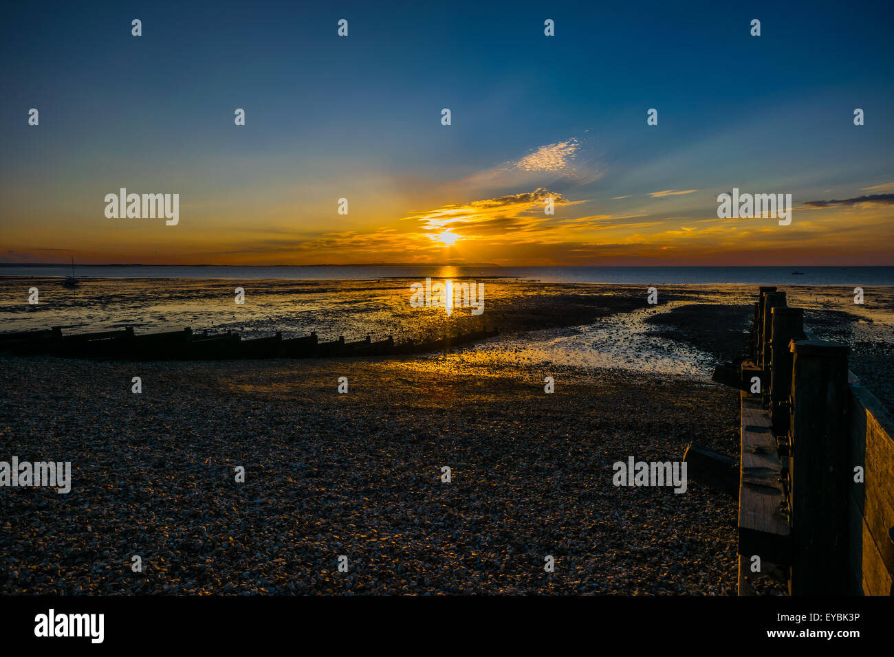Sunset over the beach of Whitstable in Kent Stock Photo - Alamy