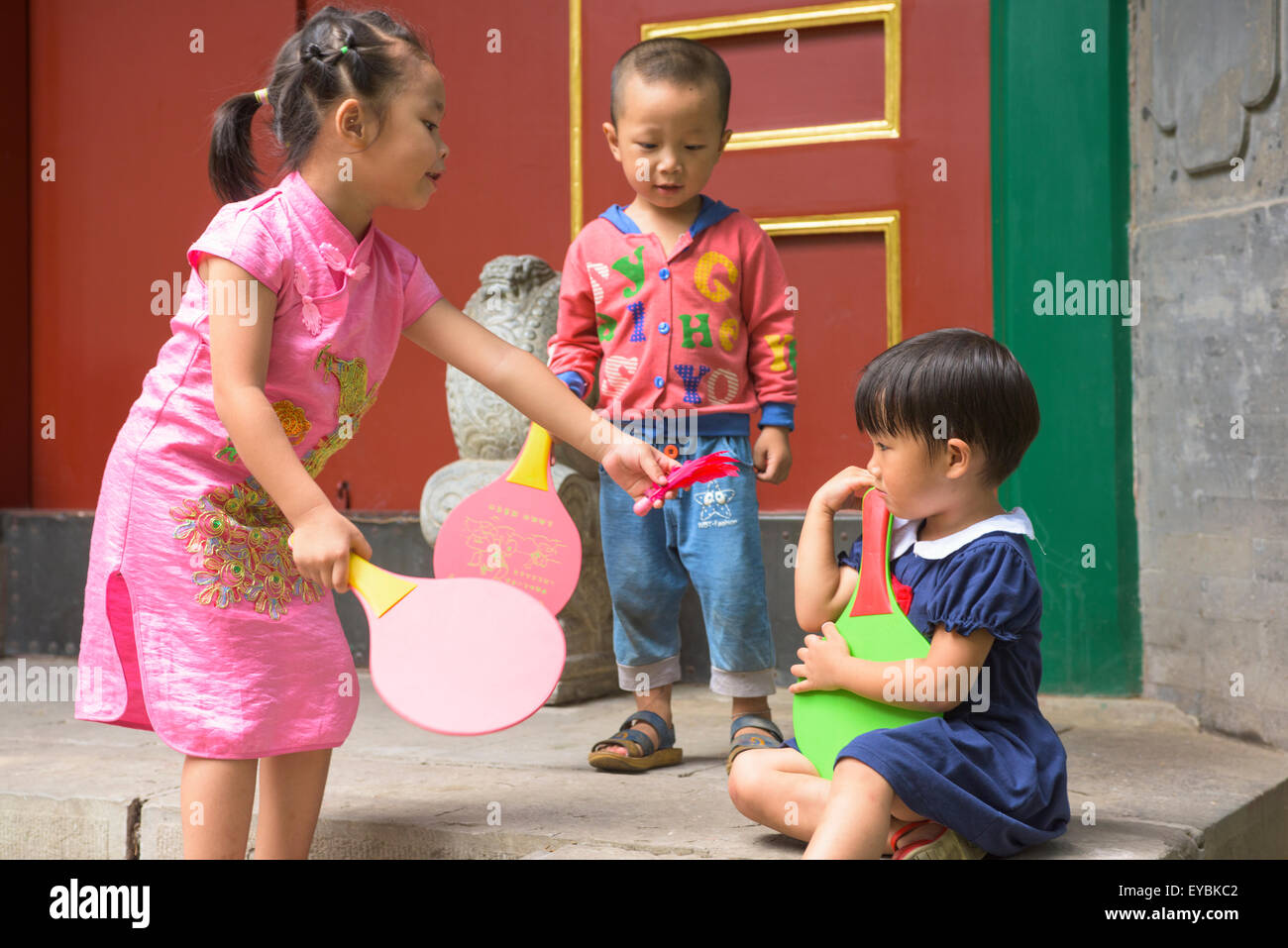 Two boys and a girl enjoying a game of ping pong at the Summer Palace ...