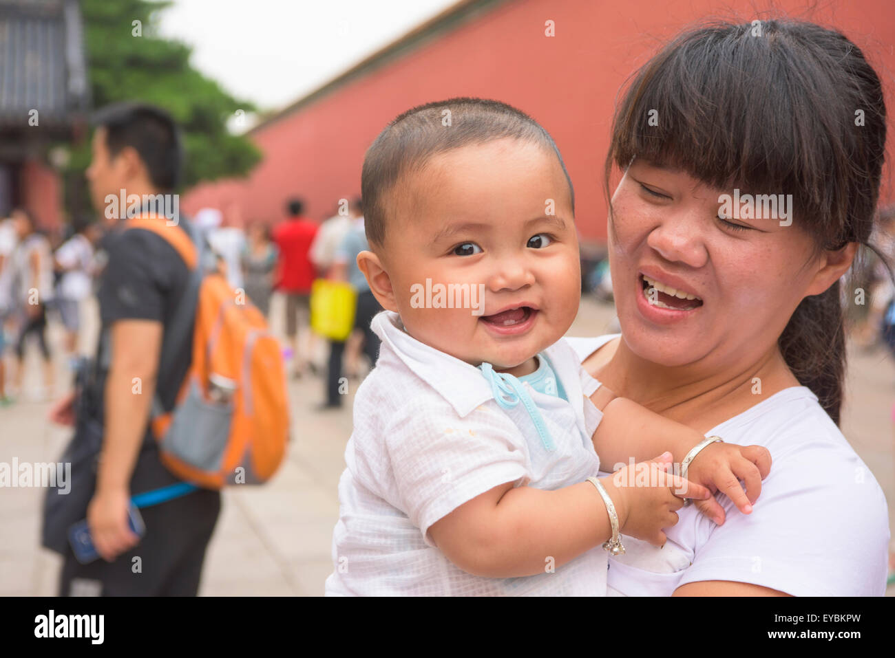 Mother and happy child at exit of Forbidden City, Beijing, China Stock ...
