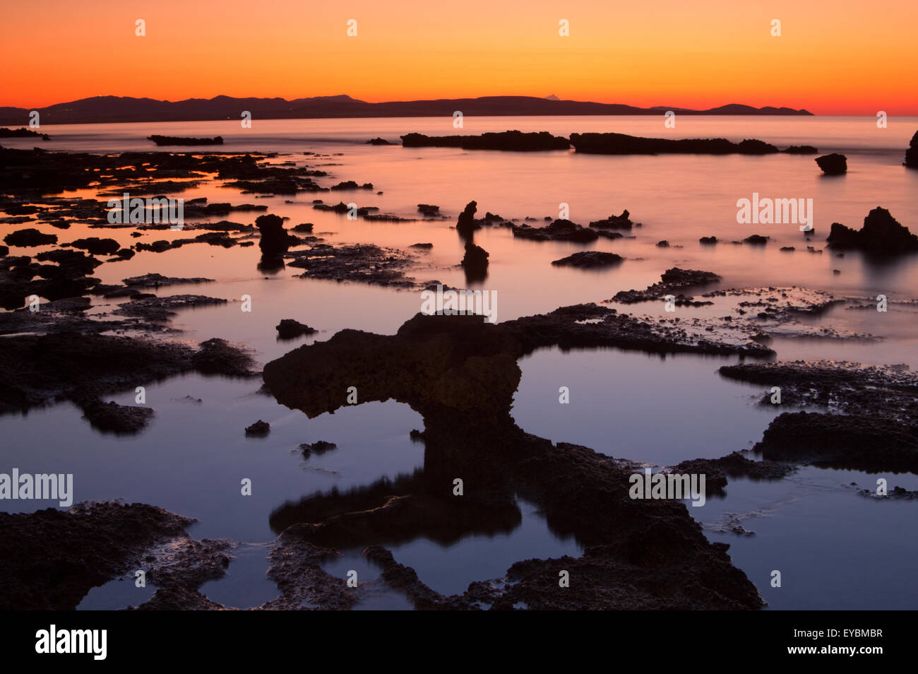 Volcanic rock formations and stagnant sea waters at Pournia bay during ...