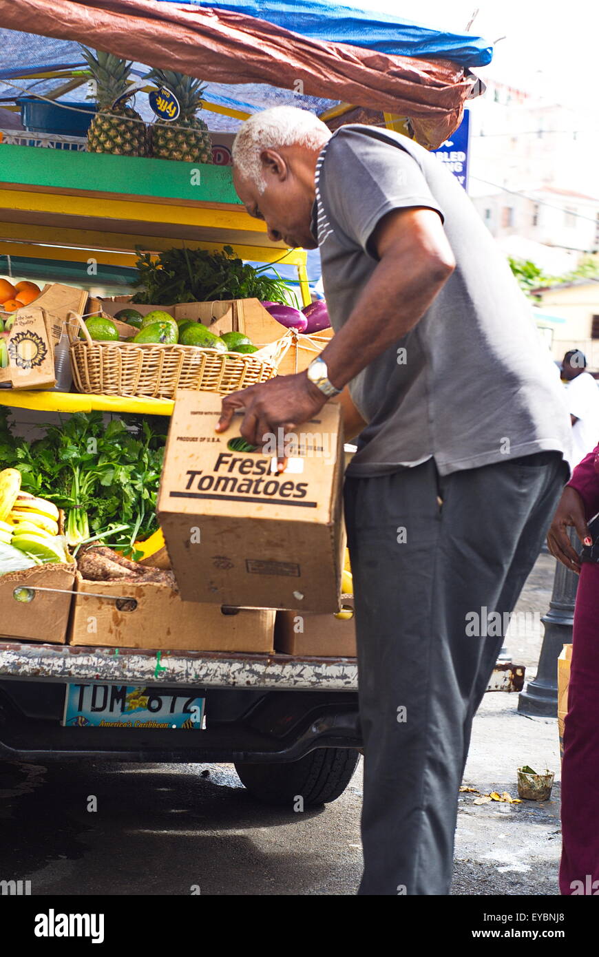 Black man selling vegetables hi-res stock photography and images - Alamy