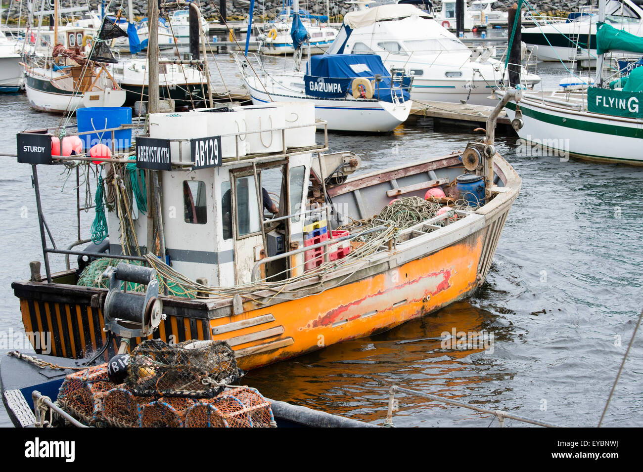 A small inshore fishing boat leaving Aberystwyth harbour Wales UK Stock ...