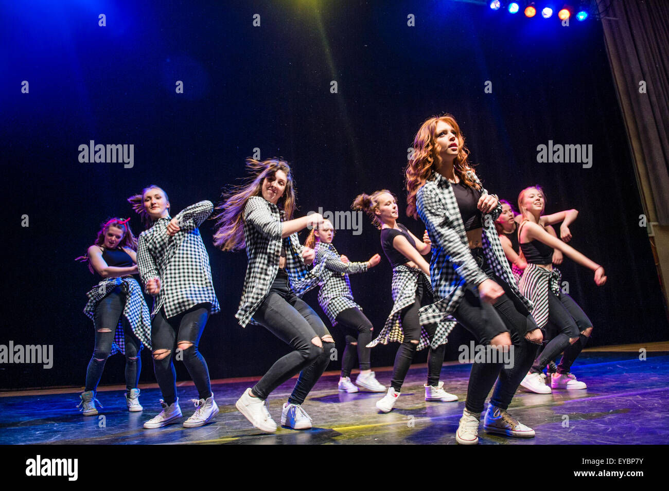 A group of teenage girls performing choreographed modern urban dance ...