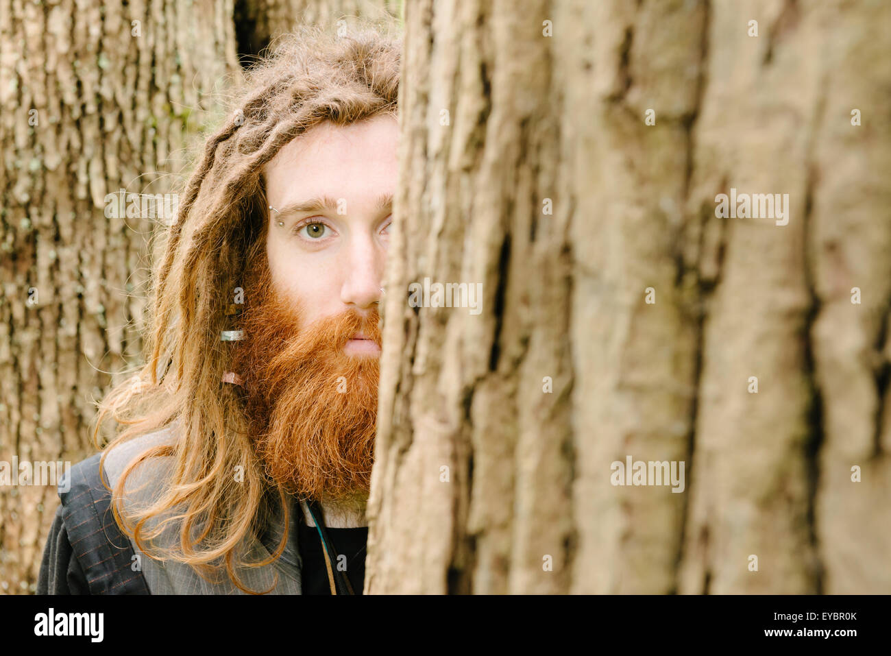 A hippy man with dreads in the forest Stock Photo - Alamy