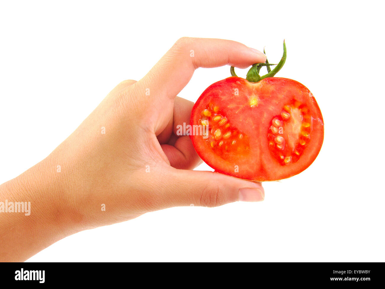 Whole tomato in the human hand isolated on white background Stock Photo ...