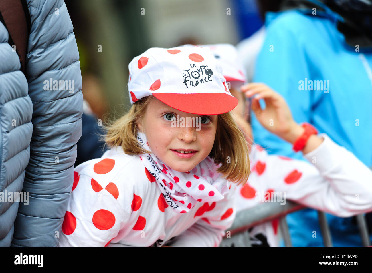 Paris, France. July 26, 2015. Young cycling fan in a polka dot outfit ...