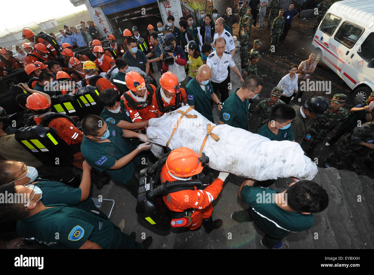 Hegang, China's Heilongjiang Province. 27th July, 2015. Rescuers carry ...