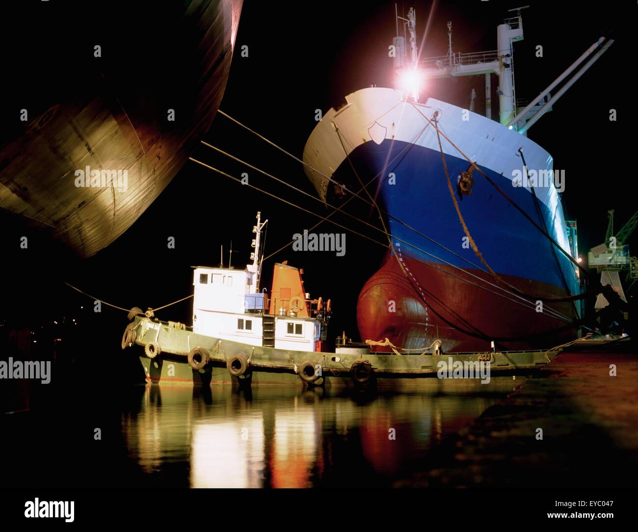 Shipping; Ship And Boat Illuminated At Night Stock Photo - Alamy